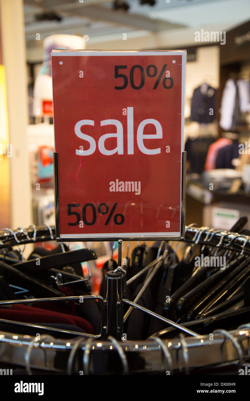 Sale display at top of clothing stand at retail store Stock Photo - Alamy