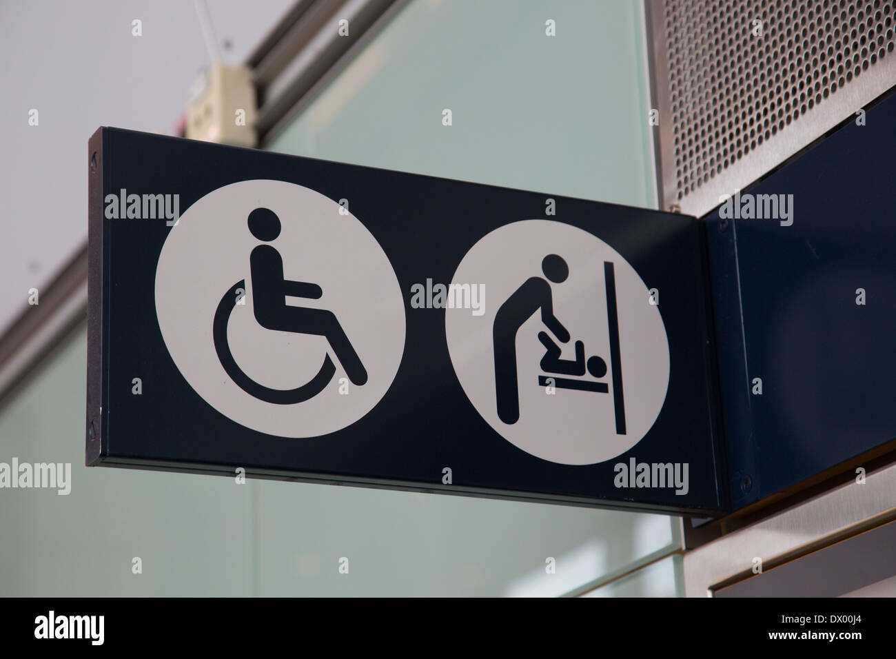 Directional sign pointed disabled and parents towards restrooms Stock ...