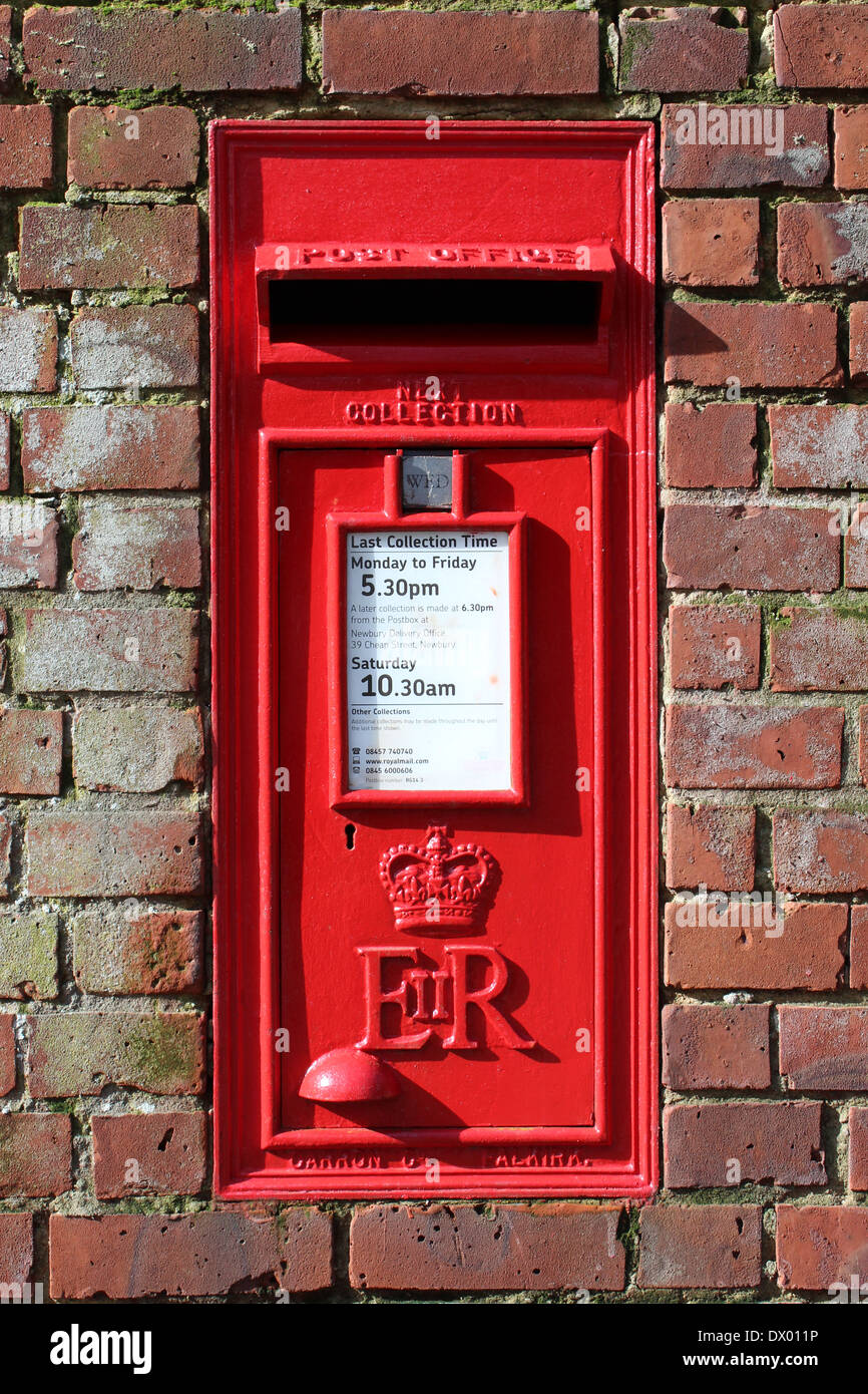 Red post box set into a brick wall Stock Photo - Alamy