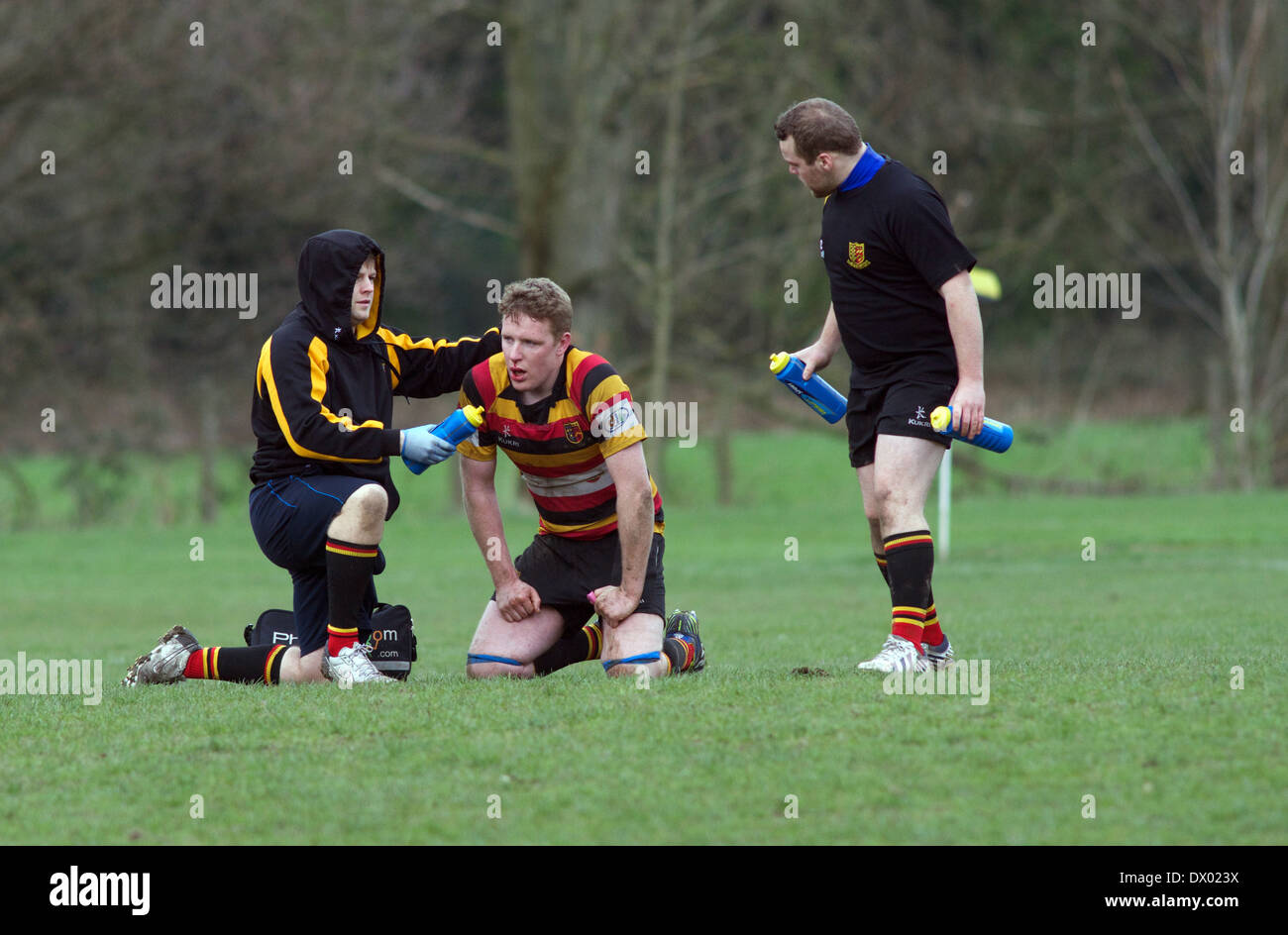 a heaton moor rugby player receives attention for an injury during the ...