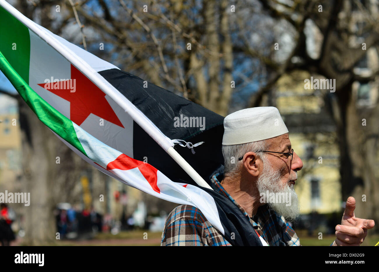 Washington DC, USA . 15th Mar, 2014. SAMIR HINEID, from Virginia holds ...