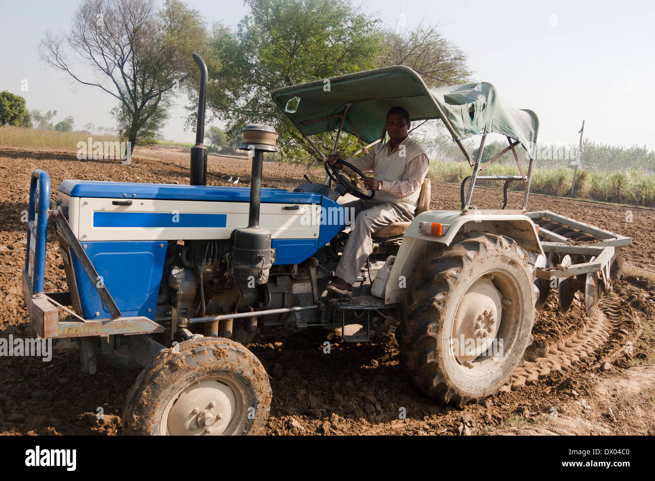 Side view of tractor with plough hi-res stock photography and images ...