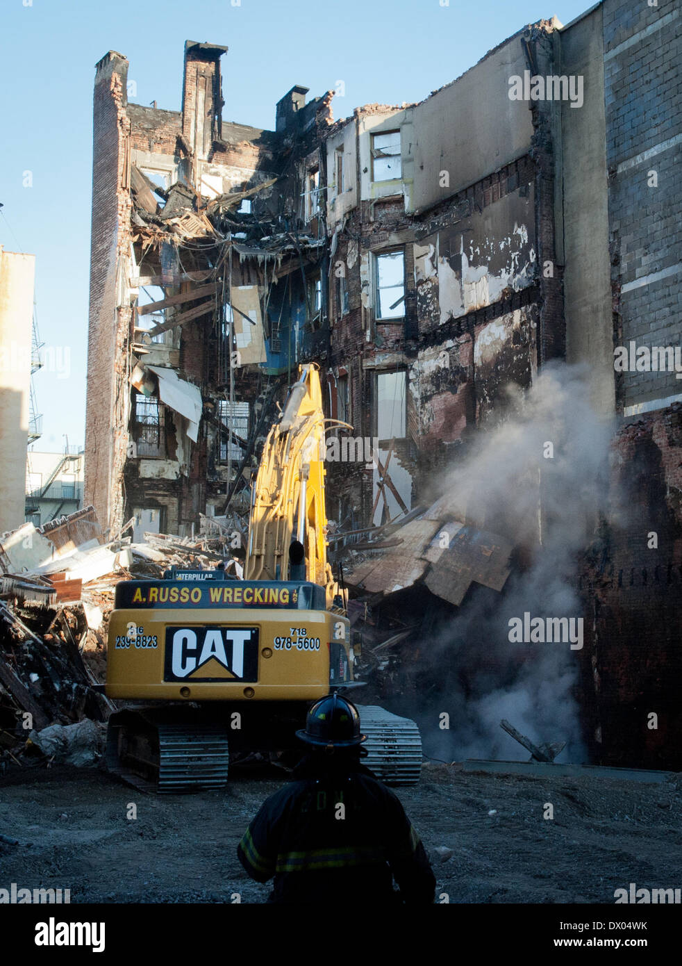 Manhattan, New York, USA. 14th Mar, 2014. Workers and firefighters ...