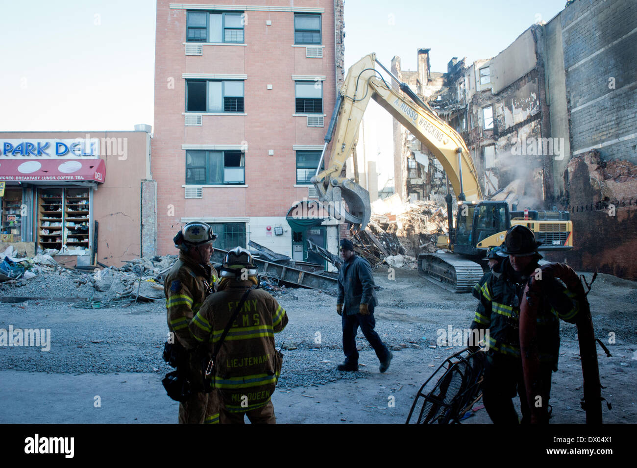 Manhattan, New York, USA. 14th Mar, 2014. Workers and firefighters ...