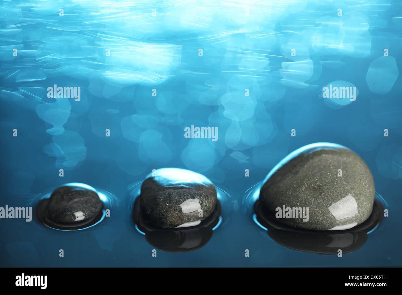 Stones in water Stock Photo - Alamy