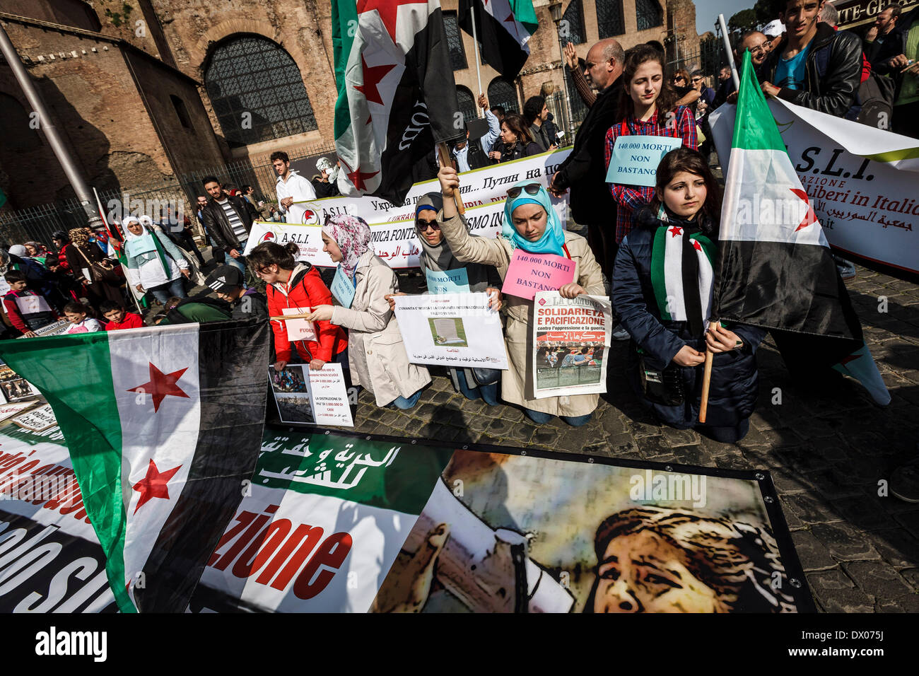 Rome, Italy – March 15, 2014: Syrian demonstrators hold banners and ...