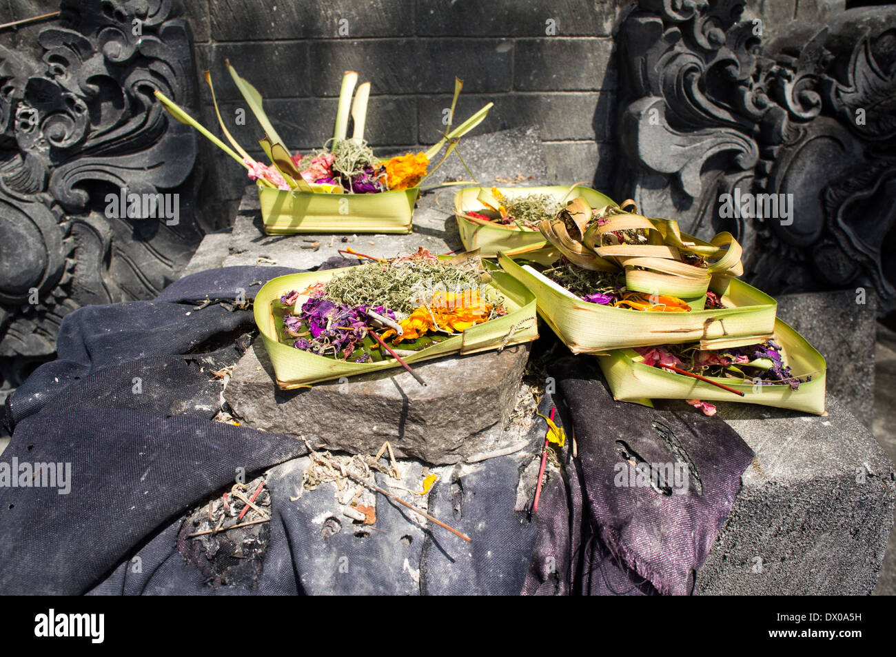Traditional offerings to gods with flowers and aromatic sticks, Pura ...