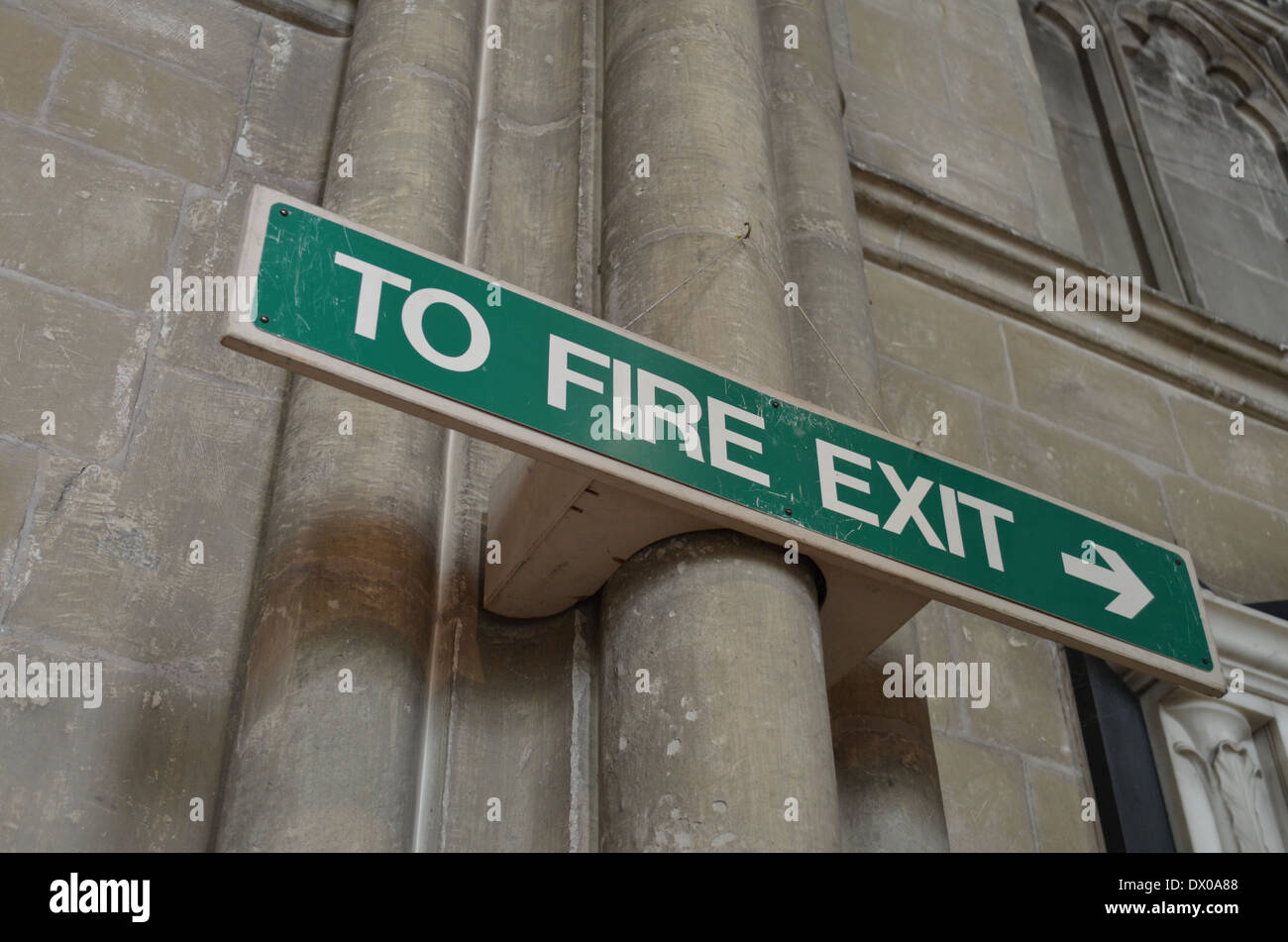 To fire exit sign in a gothic style building Stock Photo - Alamy