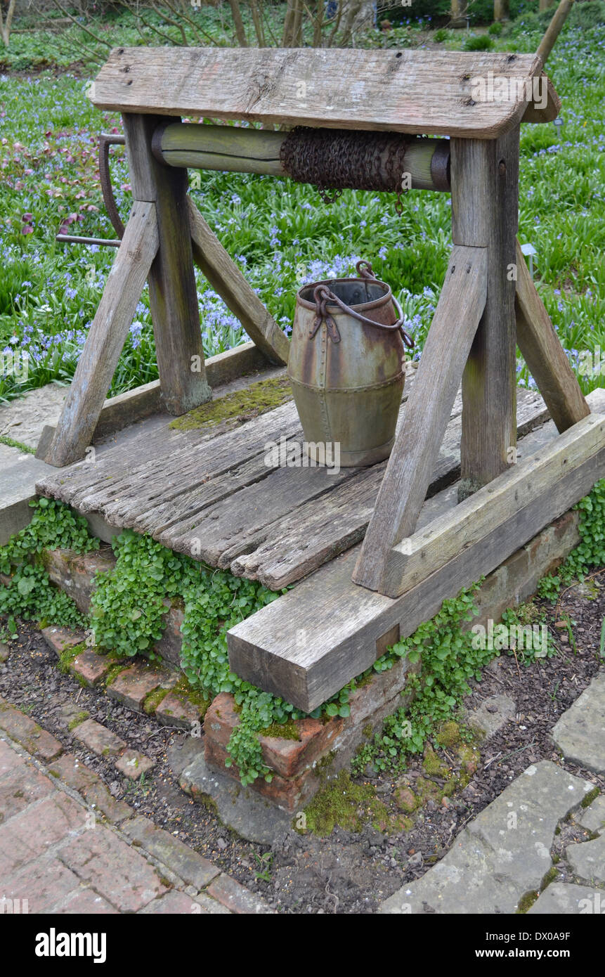 A garden well with a water bucket Stock Photo - Alamy