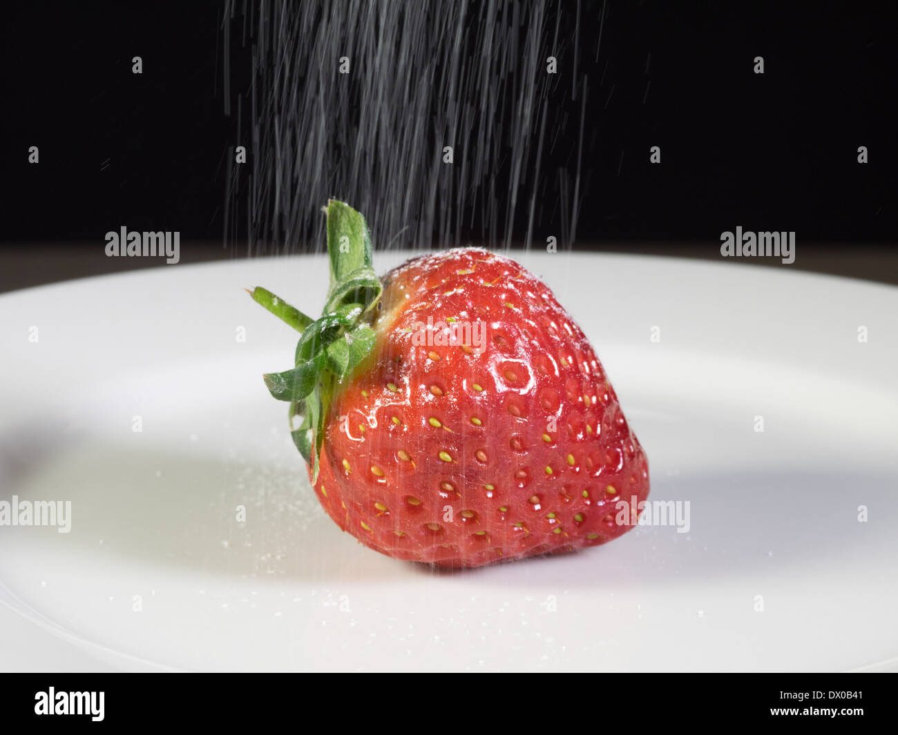 Strawberry on a white plate Stock Photo - Alamy