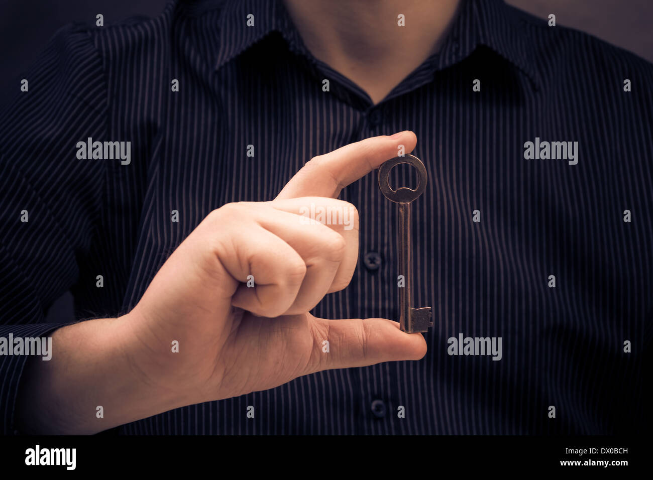 Hand holding key man hi-res stock photography and images - Alamy