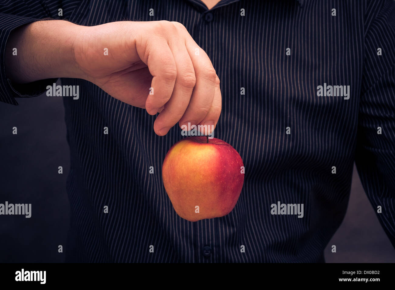 Man hold apple hi-res stock photography and images - Alamy