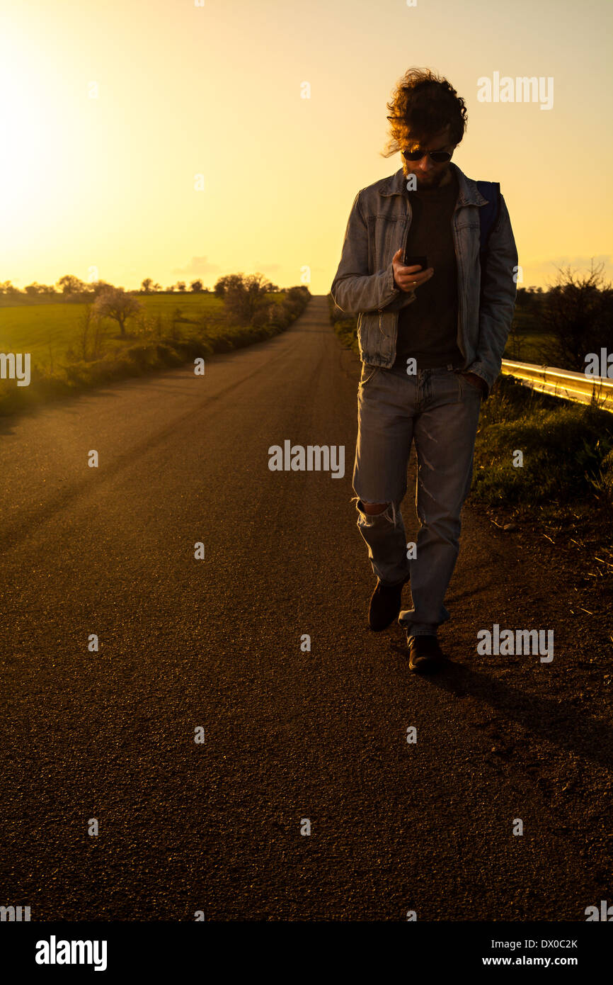 Man walking to sun road hi-res stock photography and images - Alamy