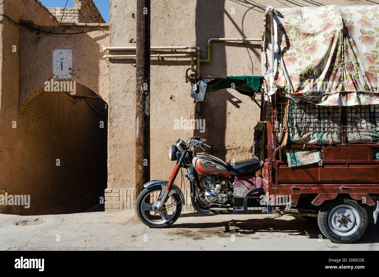 Motorcycle and cart in Iran Stock Photo - Alamy