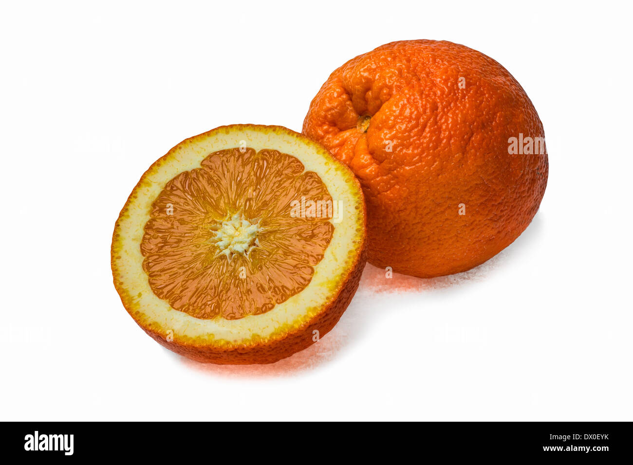 Oranges whole and a half. Two oranges. One of them whole, another one ...