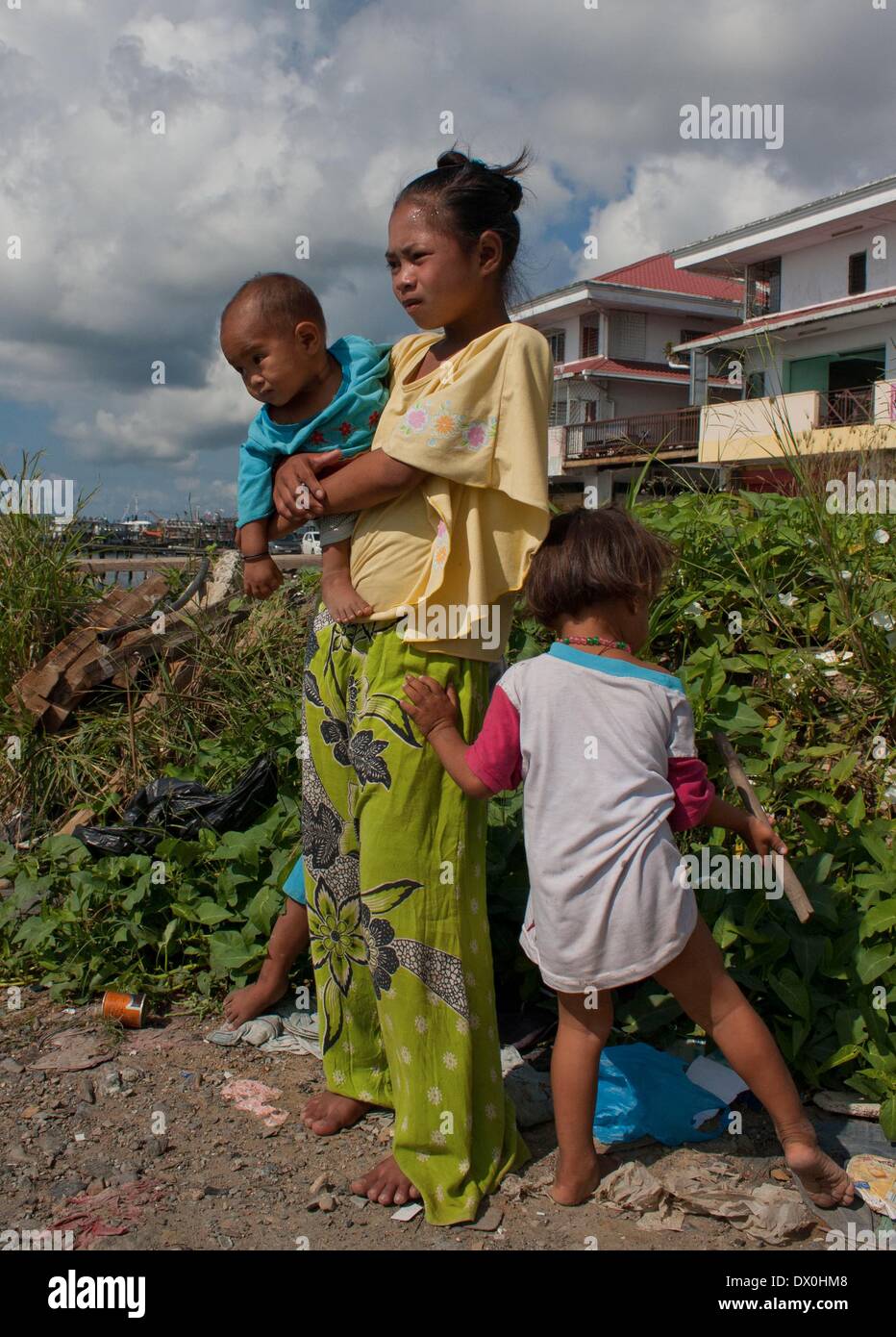 A Bajau girl with her siblings in Lahad Datu, Sabah, Malaysia, 24 ...