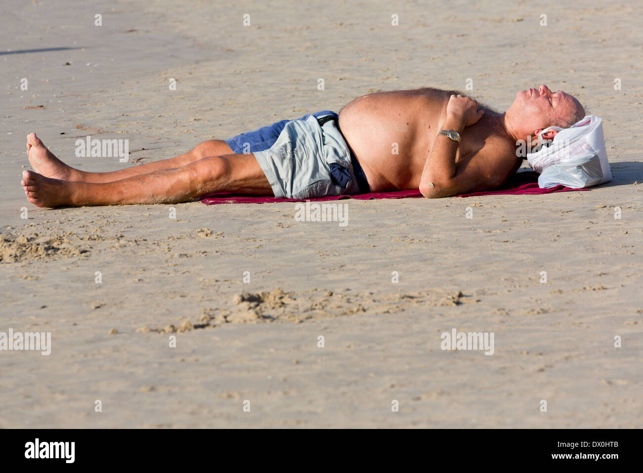 Taking a Sunbath on Patong Beach, Phuket, Thailand Stock Photo - Alamy