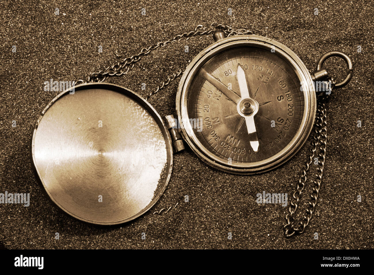 Black and white compass on sand background Stock Photo - Alamy