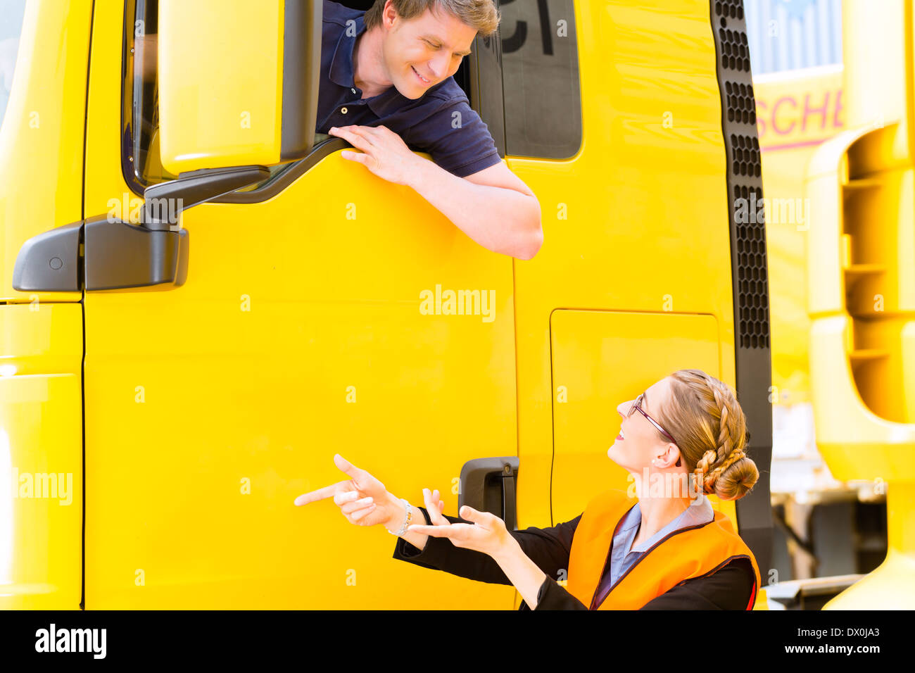 Logistics - proud driver or forwarder in drivers cap of truck and ...