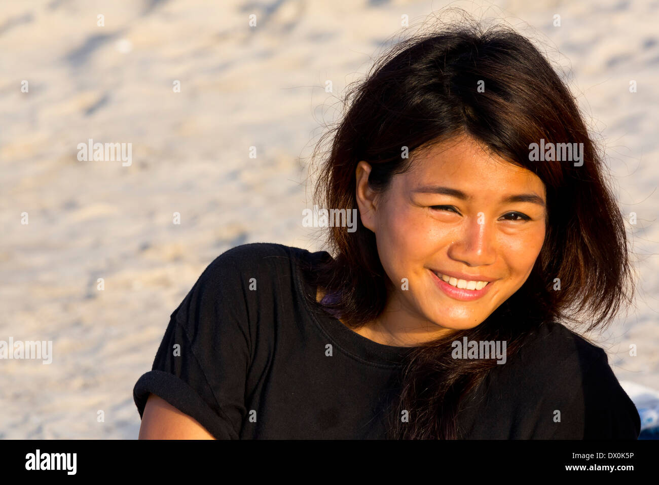 Woman taking sunbath on the beach hi-res stock photography and images ...