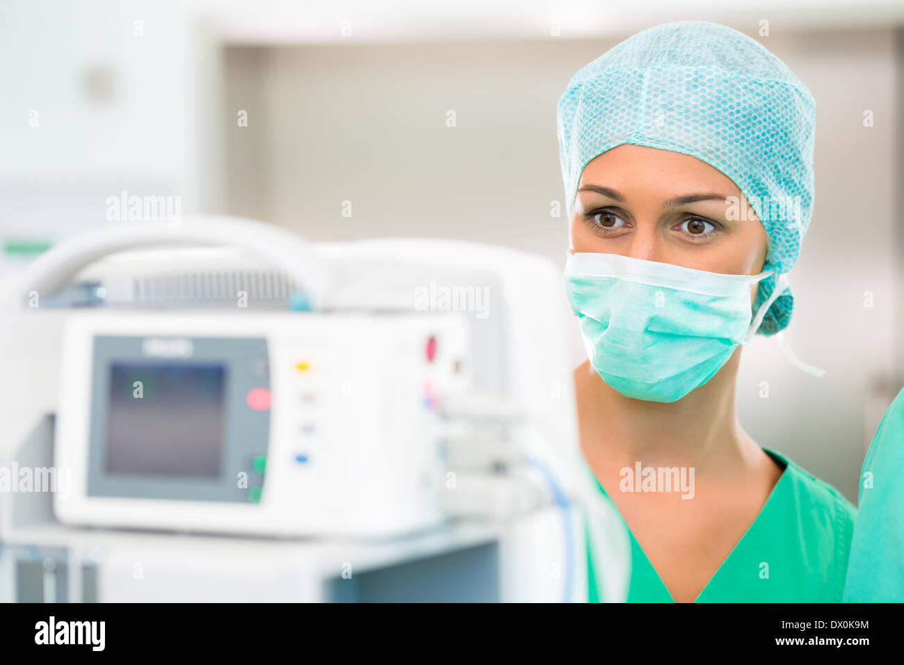 Nurse checking heart monitor hi-res stock photography and images - Alamy