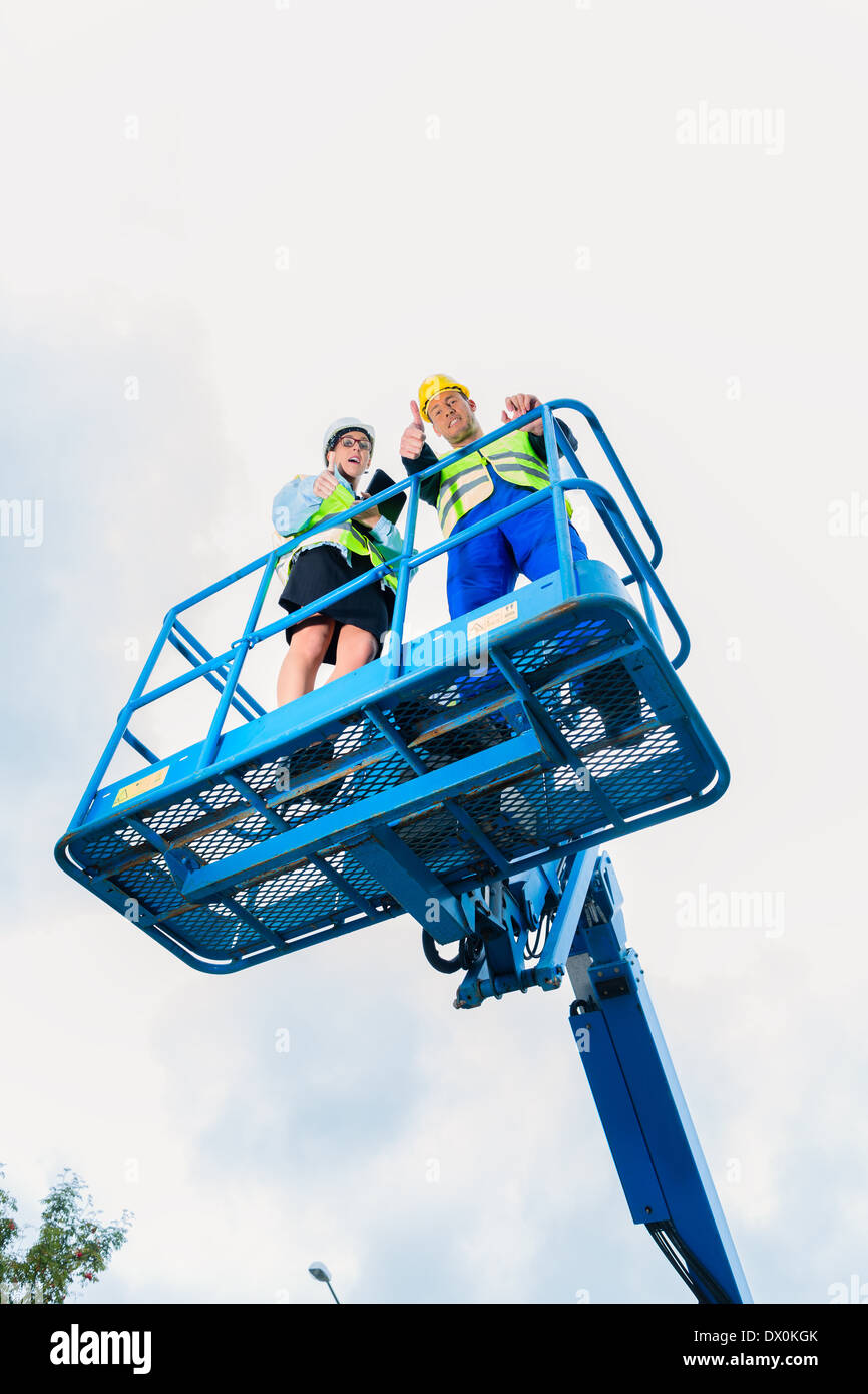 Woman Construction Worker On Platform High Resolution Stock Photography ...