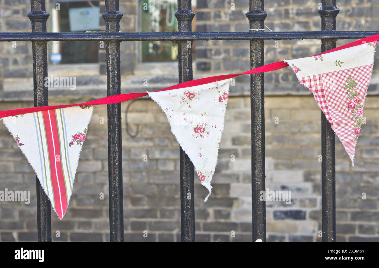 Vintage bunting on metal railings at a country fair Stock Photo - Alamy