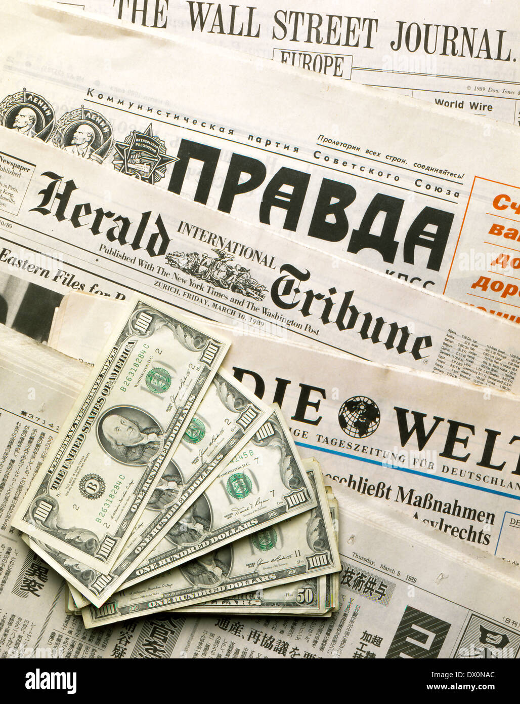 US Dollar banknotes on newspapers Stock Photo - Alamy