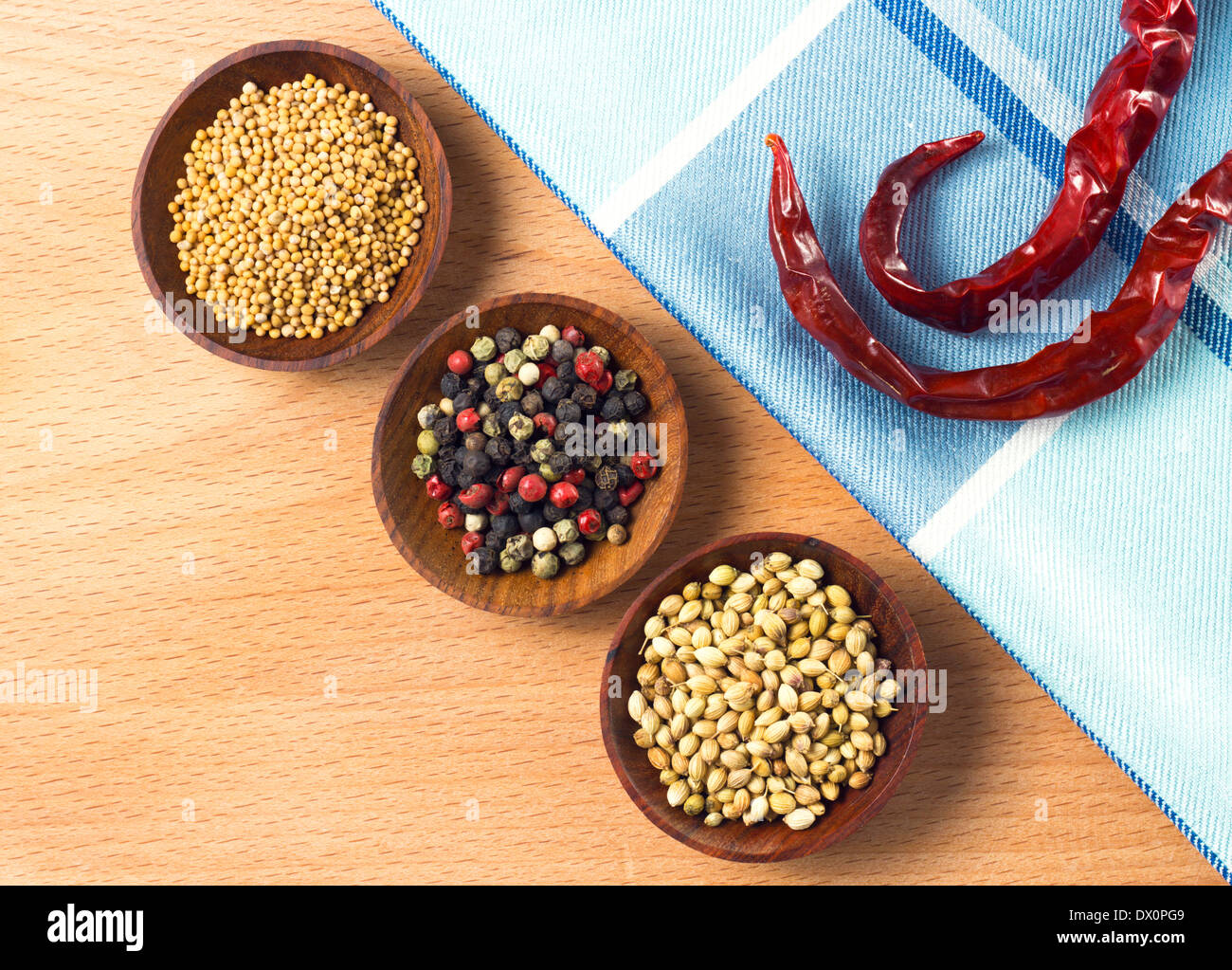 peppers mustard and cardamon on wooden background Stock Photo - Alamy