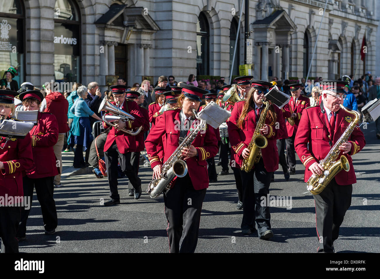 London, UK. 16 March 2014. The Castlerea Brass and Pipe Band marching ...