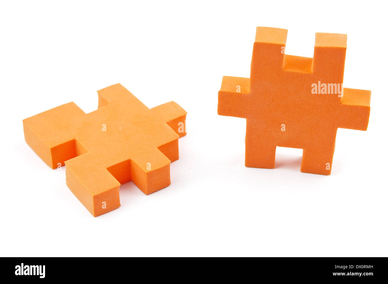 orange jigsaw puzzle pieces. Close up Stock Photo - Alamy