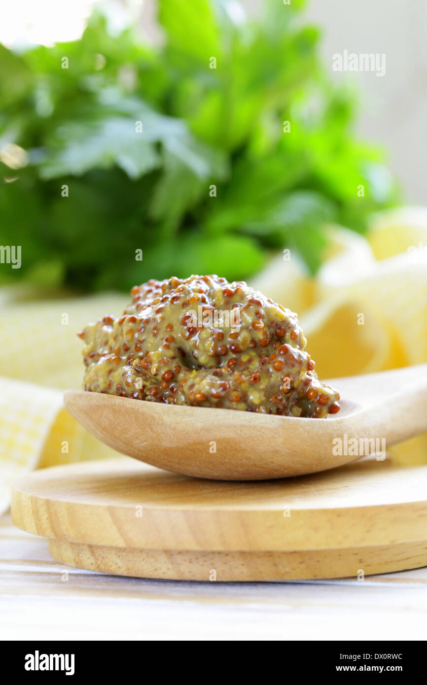 Traditional dijon mustard in a wooden spoon Stock Photo - Alamy