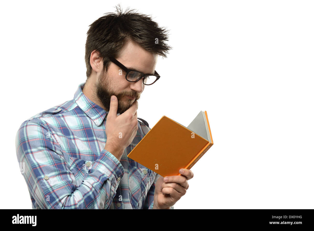 Portrait of young man reading isolated over white background Stock ...