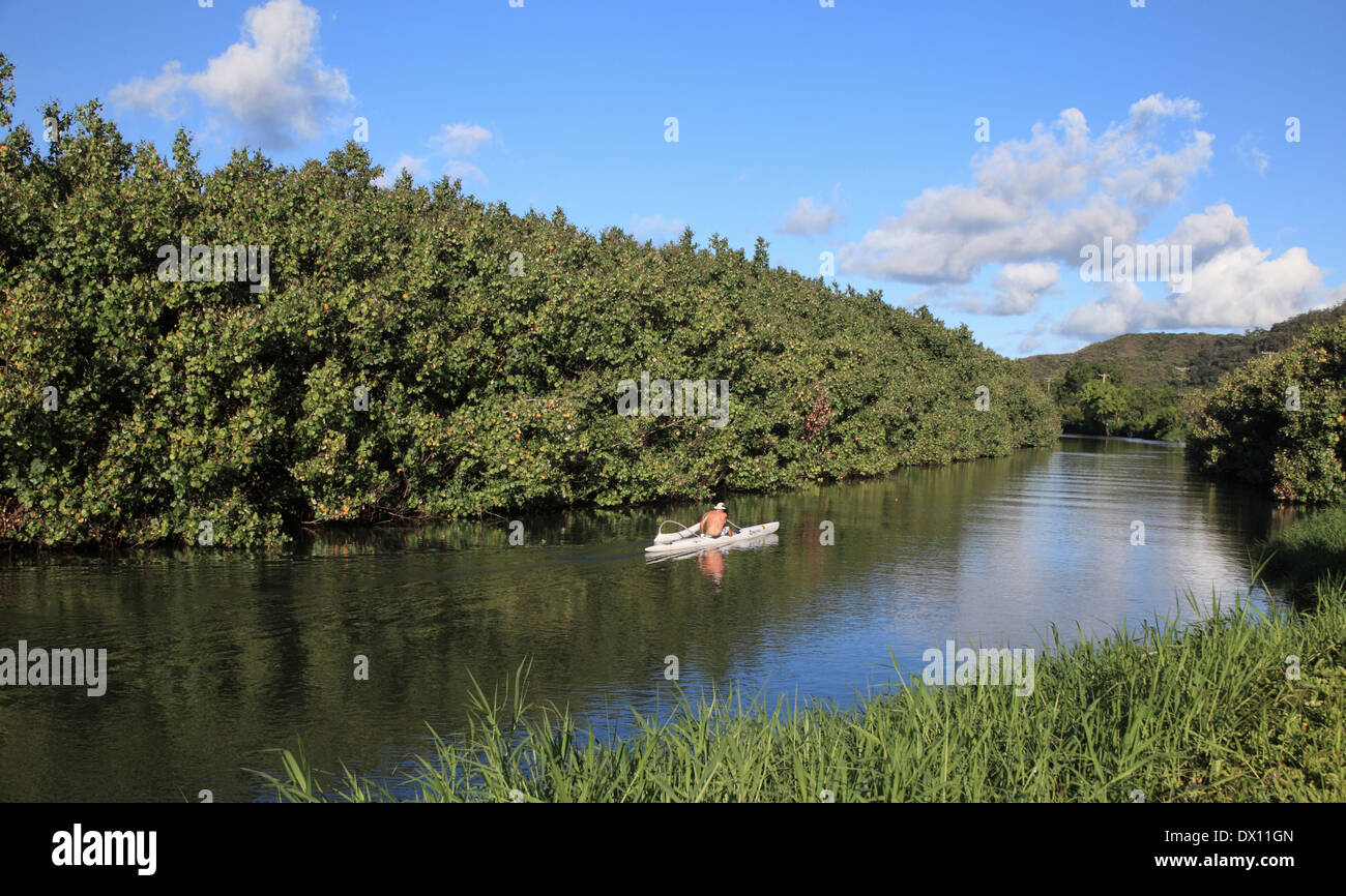 One-person outrigger canoe on the Hanalei River on Kauai Stock Photo ...