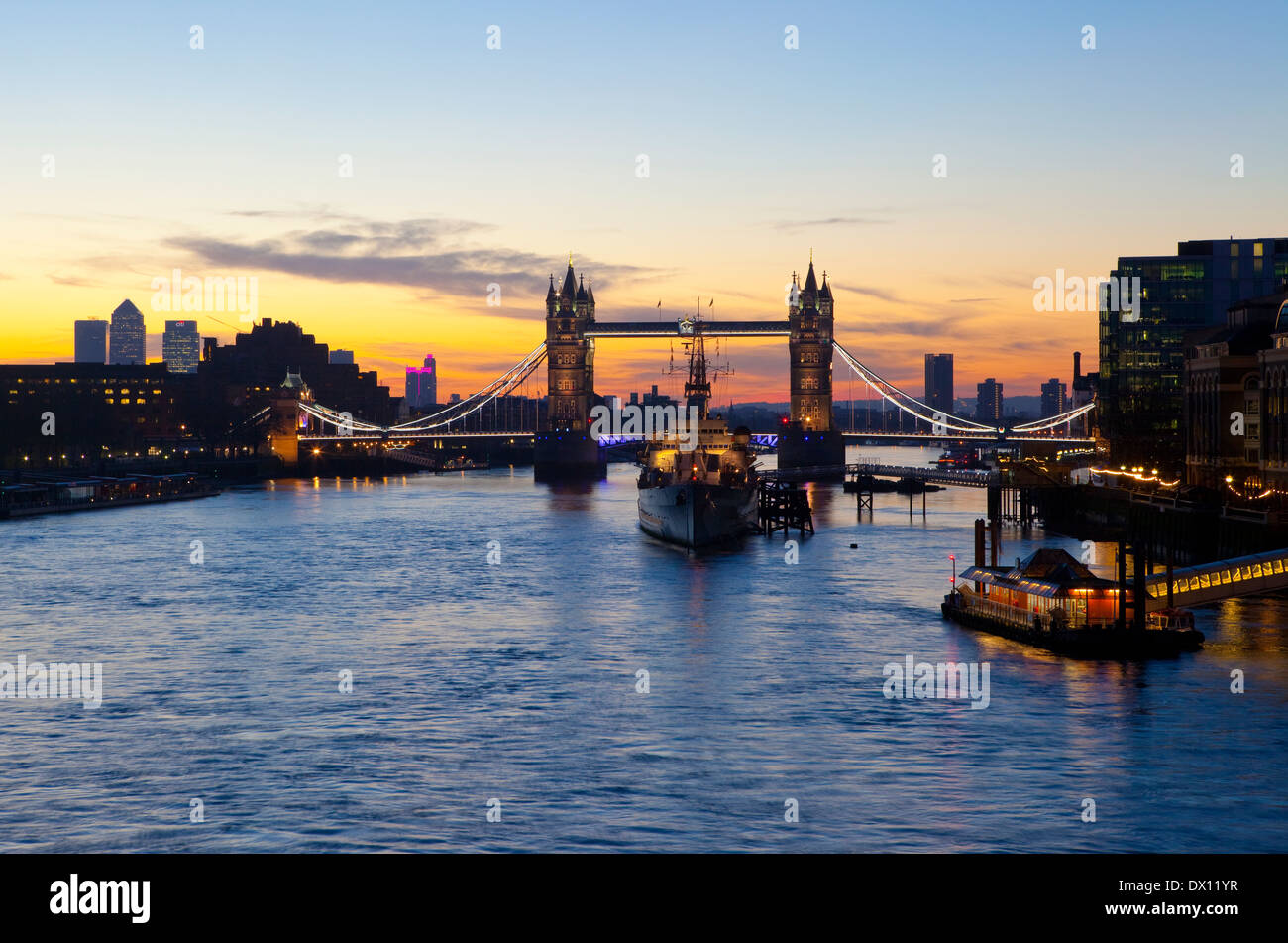 London sunrise with Tower Bridge, HMS Belfast and the River Thames in the foreground Stock Photo ...