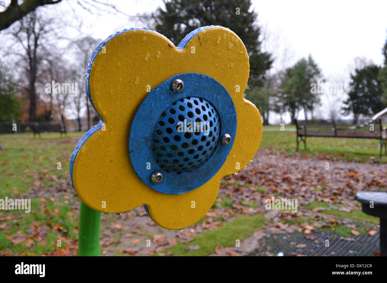 Flower speaker in the park with rain droplets Stock Photo - Alamy