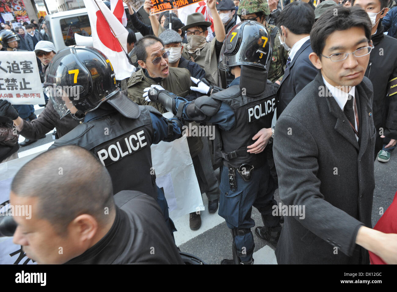 Tokyo, Japan. 16th Mar, 2014. Anti-racist Japanese clashed with members ...