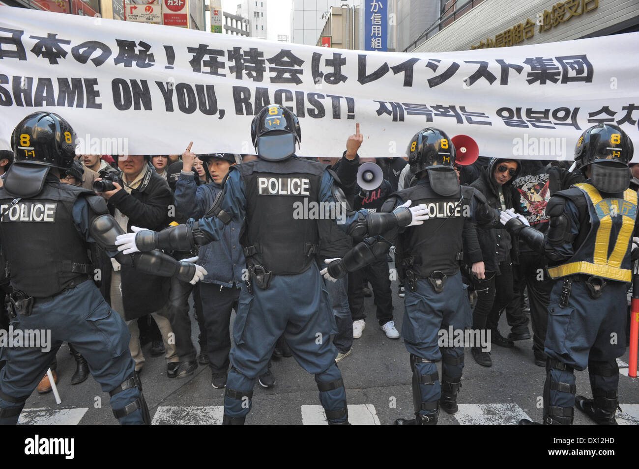 Tokyo, Japan. 16th Mar, 2014. Anti-racist Japanese clashed with members ...
