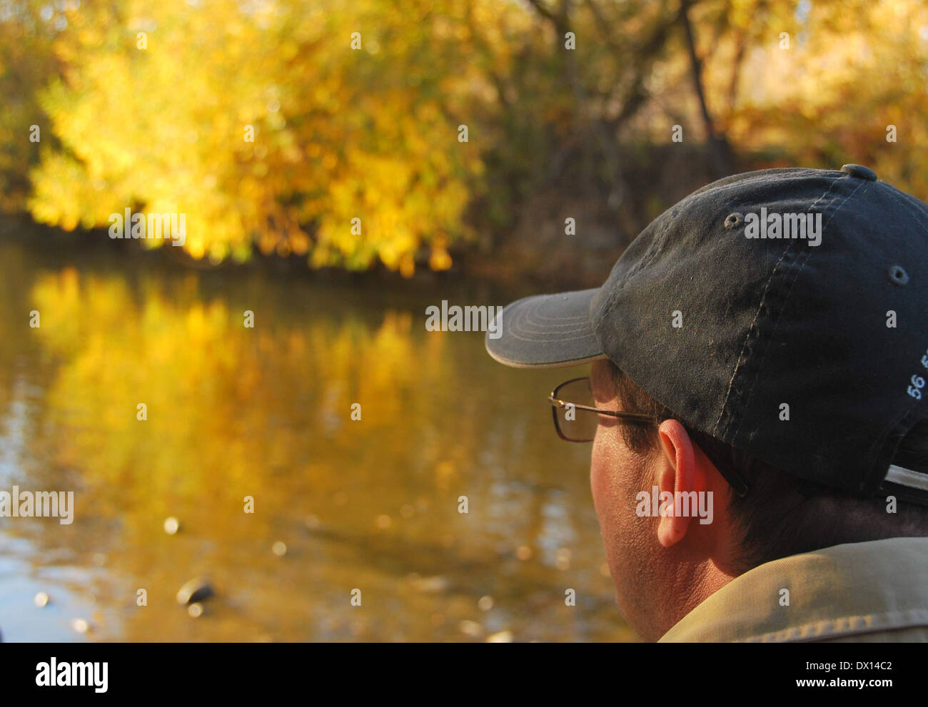 man looking out at the river Stock Photo - Alamy