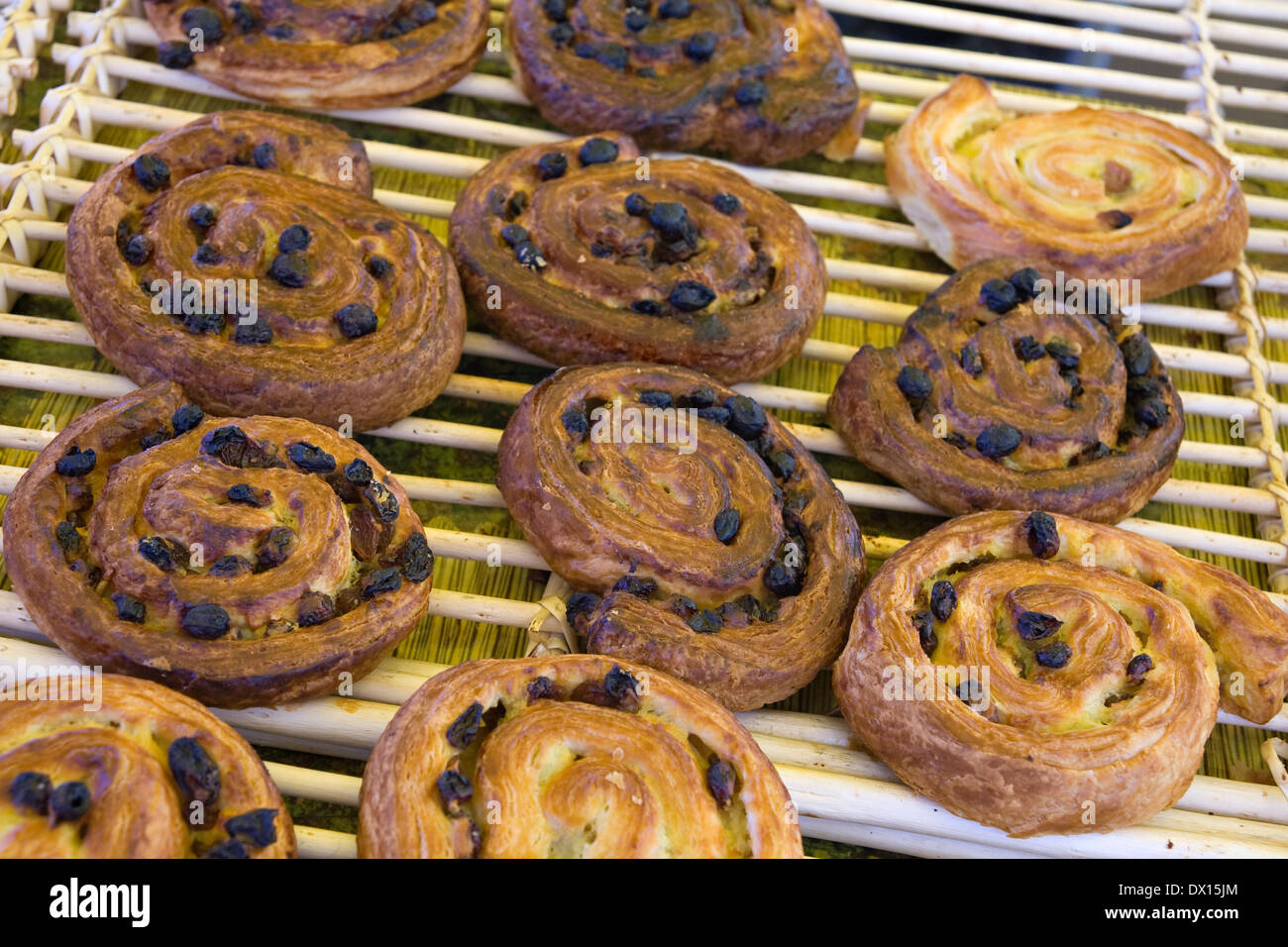 Fresh danish pastry with raisins on a tray Stock Photo - Alamy
