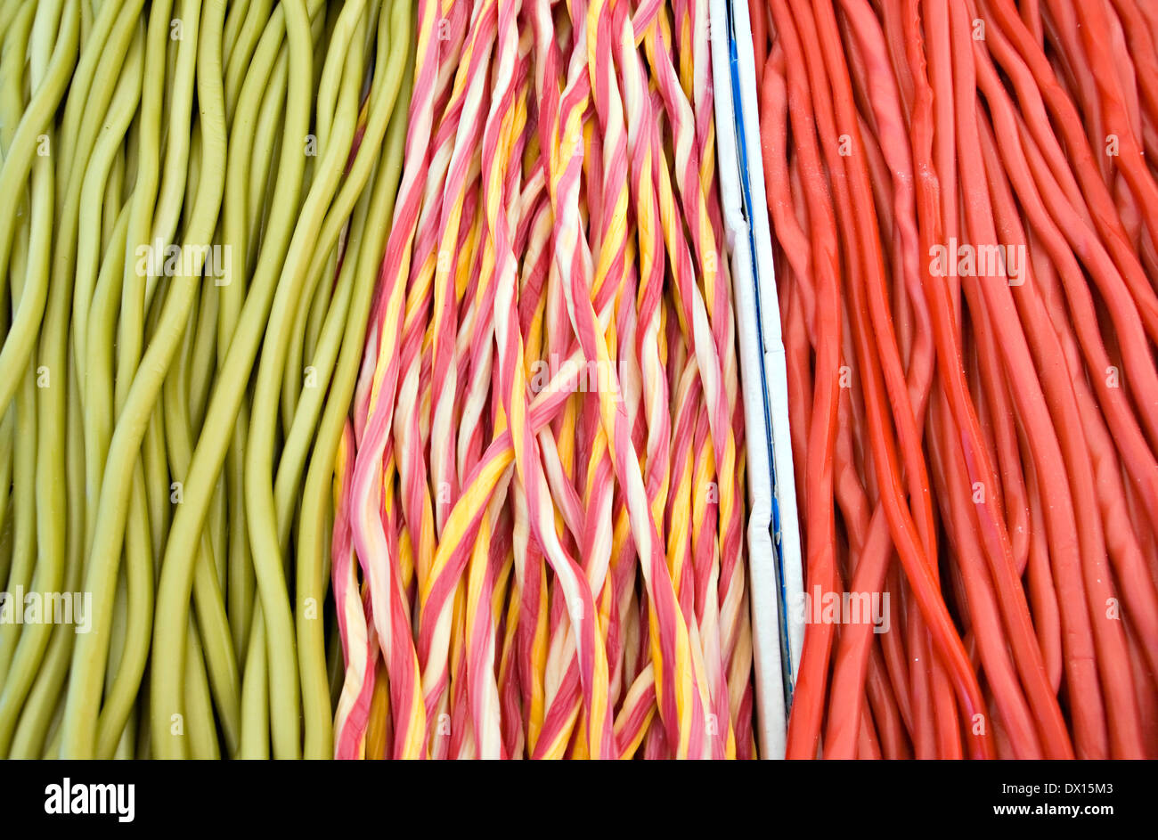 Various colour jelly sticks in a market Stock Photo - Alamy