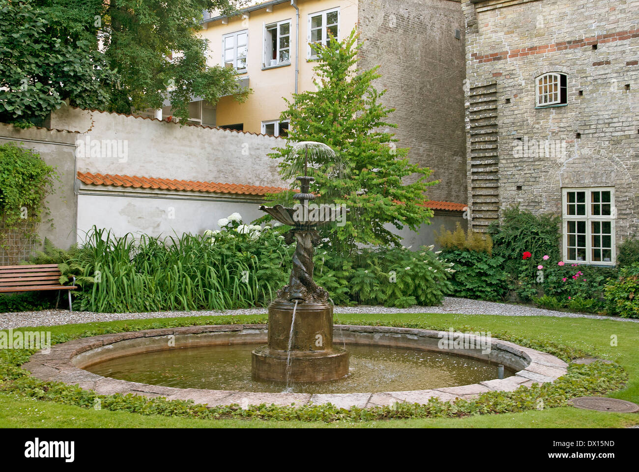Courtyard with a fountain in a northern european town Stock Photo - Alamy
