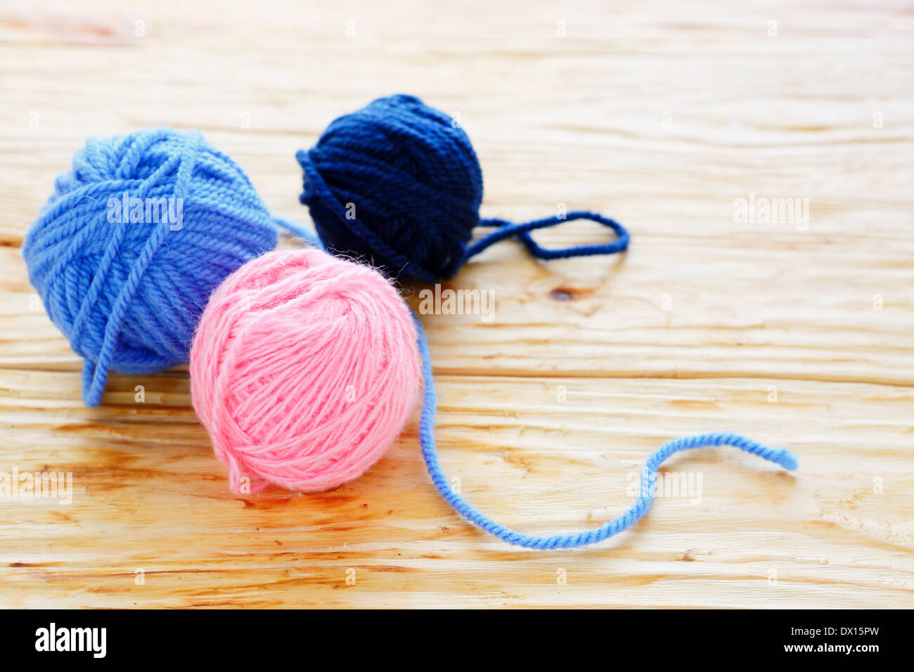 three tangle of colored thread, knitting Stock Photo - Alamy