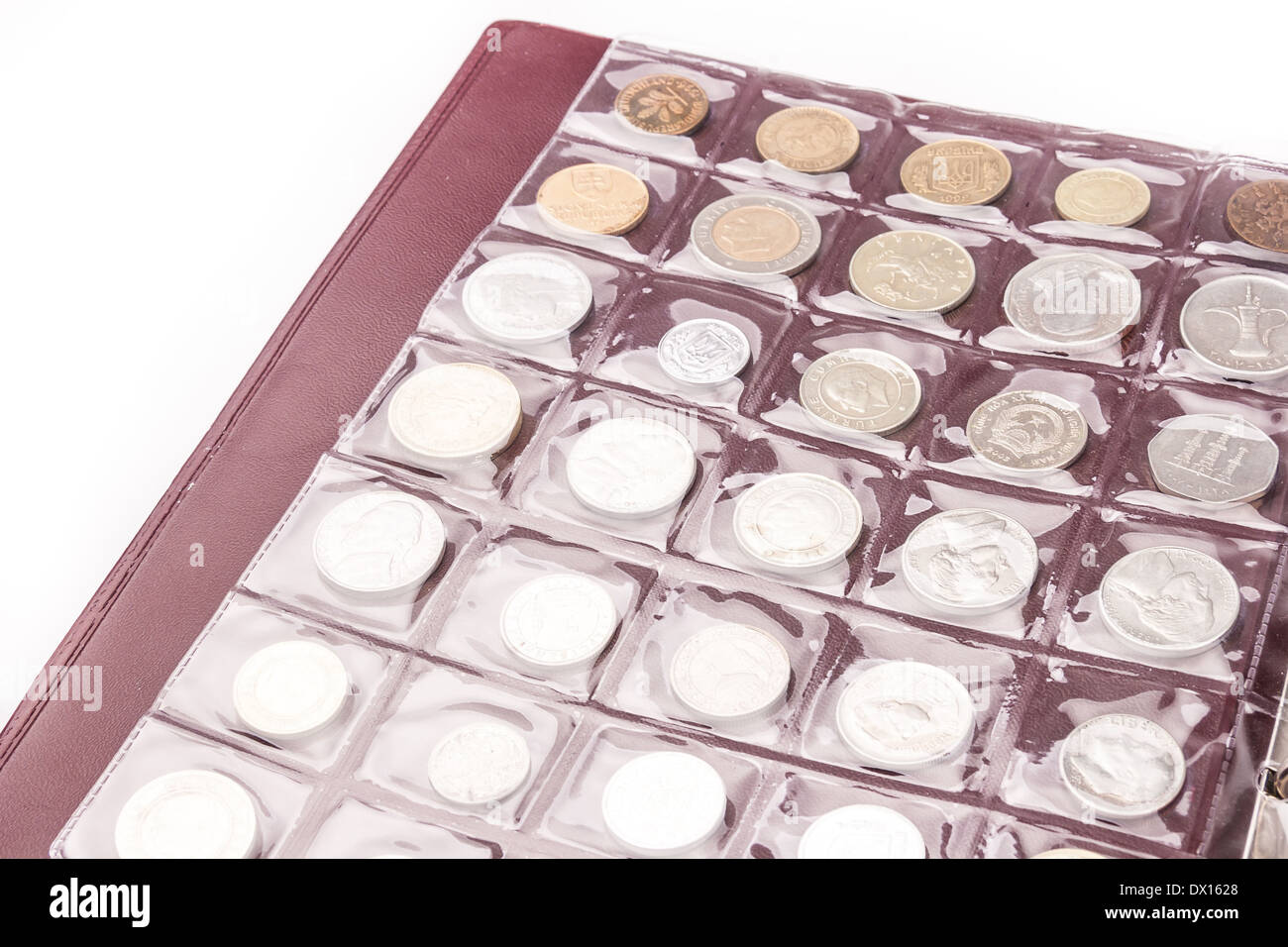 Coin album with world coins Stock Photo - Alamy