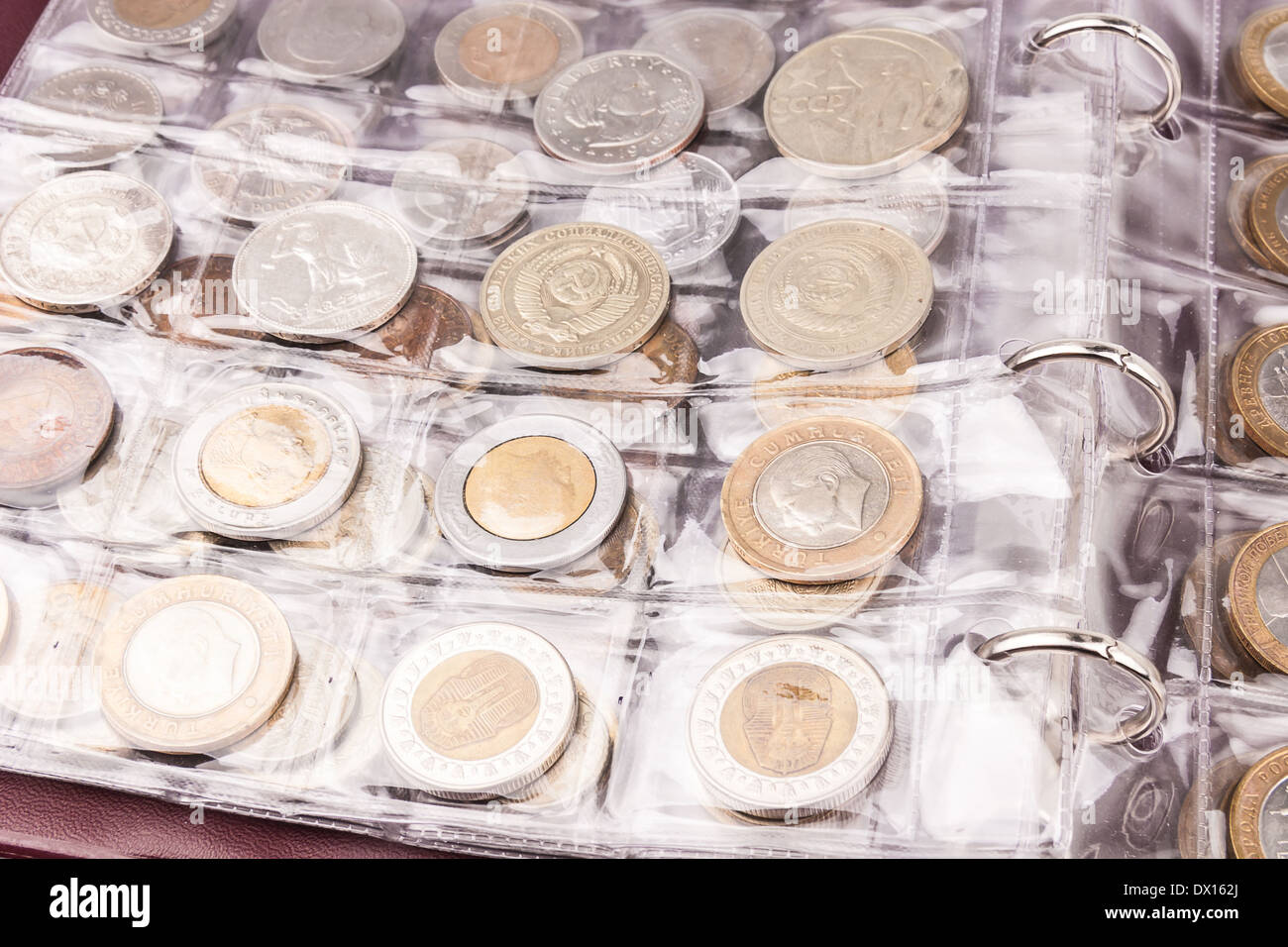 Coin album with world coins Stock Photo - Alamy