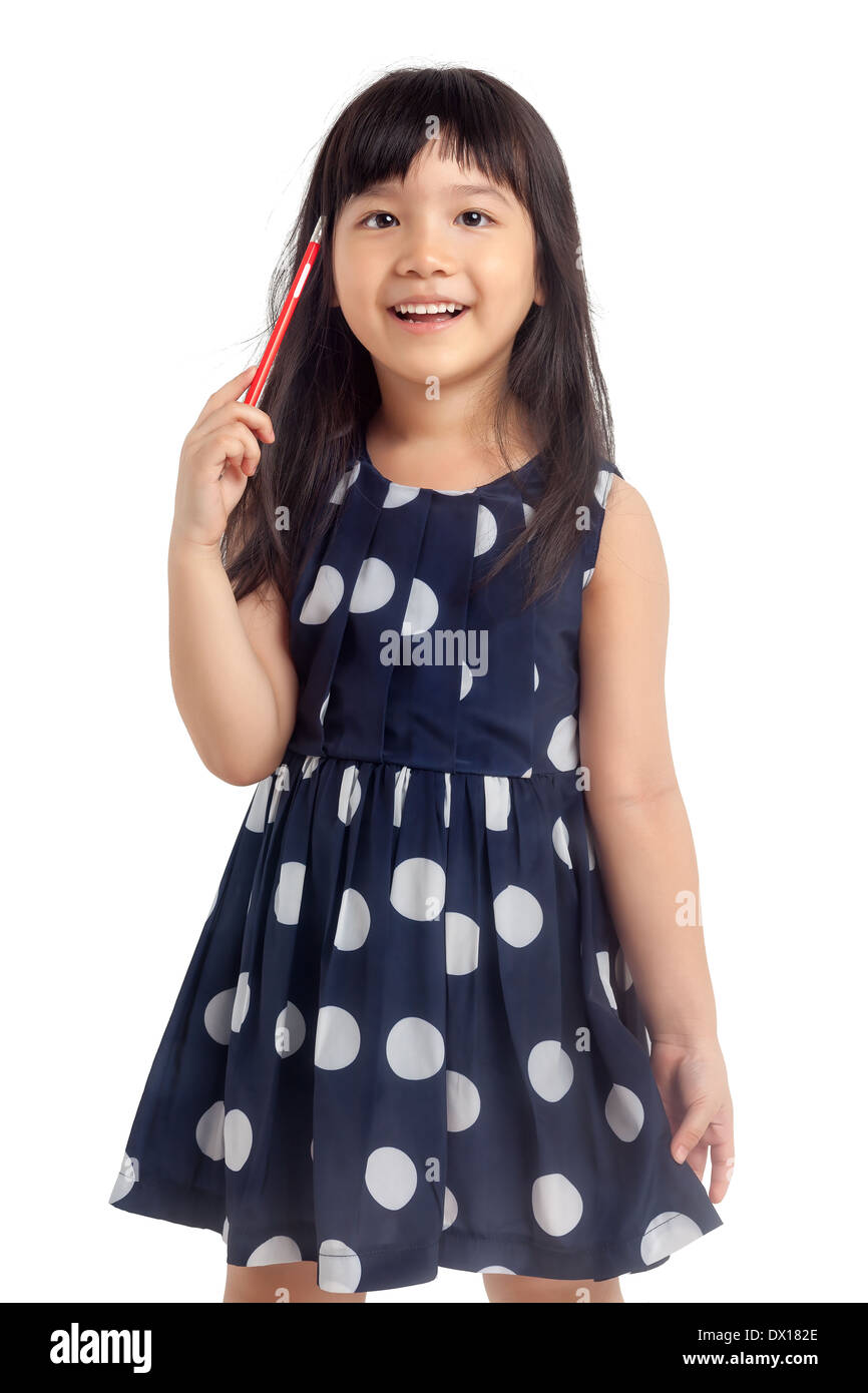 Little girl smiling holding pencil isolated on white background Stock ...