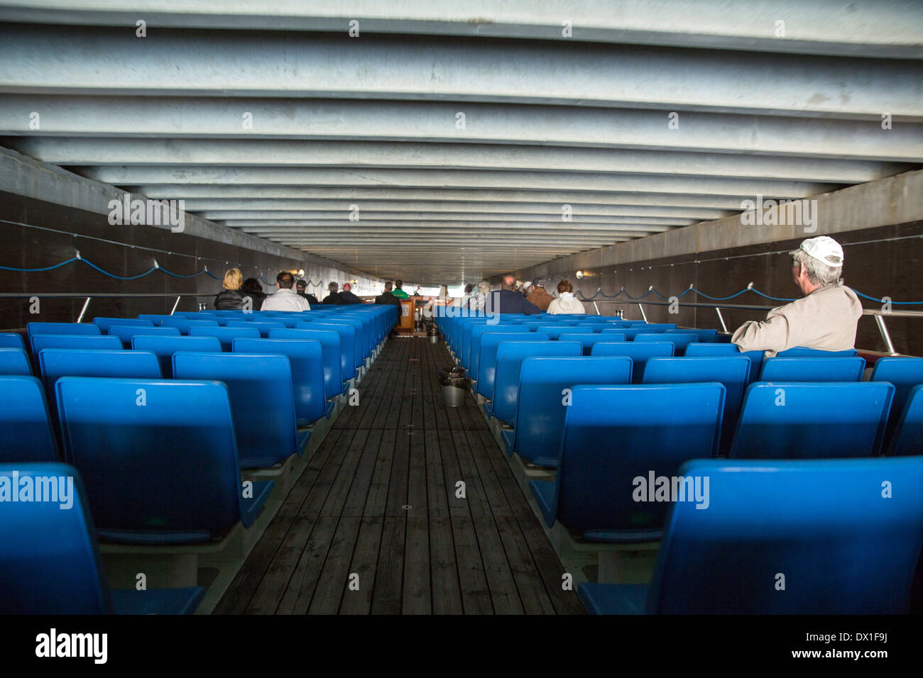 An open tourist boat passes under a low bridge in Copenhagen Stock ...