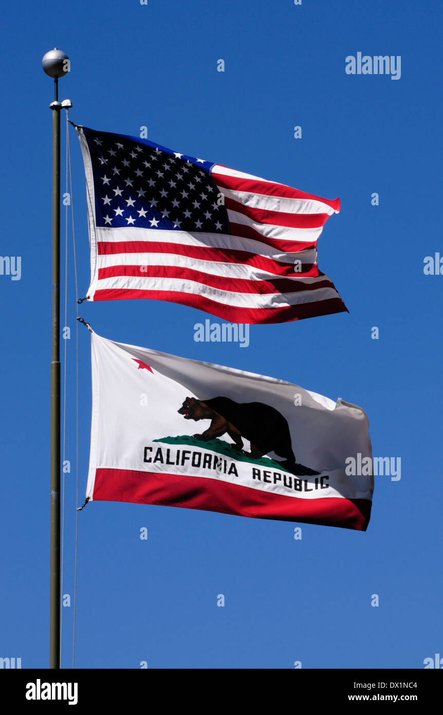 Flags of California and the United States of America blowing from flag ...