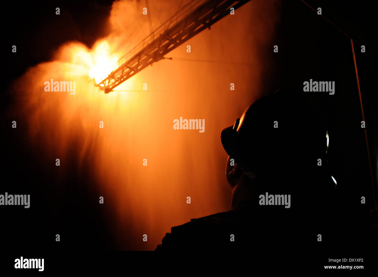 Gas from the damaged Deepwater Horizon oil well is burned off by the ...
