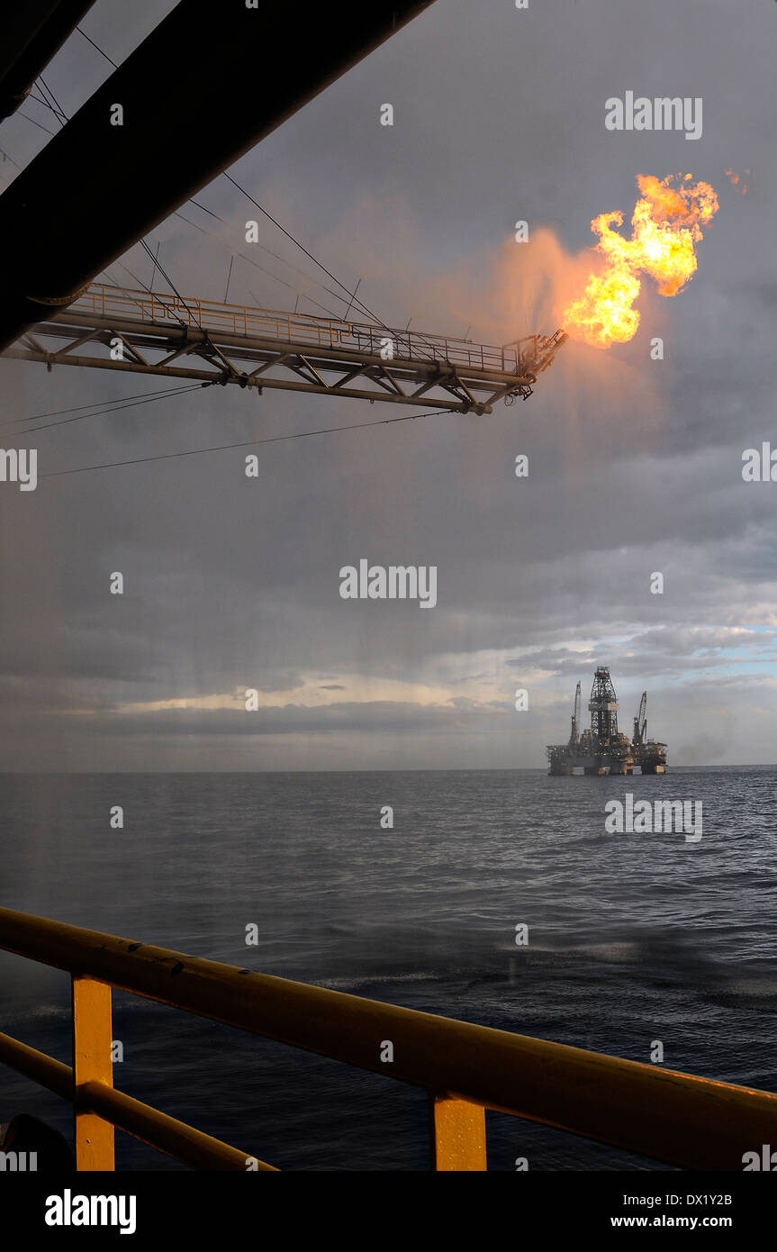 Gas from the damaged Deepwater Horizon oil well is burned off by the ...